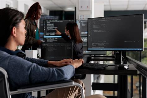 premium photo asian programmer with physical disability typing html