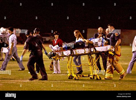 Injured High School Football Player Is Wheeled From The Field By