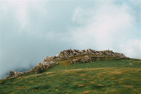 Green Grass Field Under White Sky Photo Free Grassland Image On Unsplash