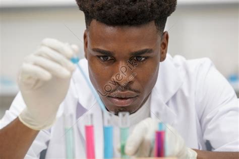 man conducting experiments with liquids in laboratory picture picture
