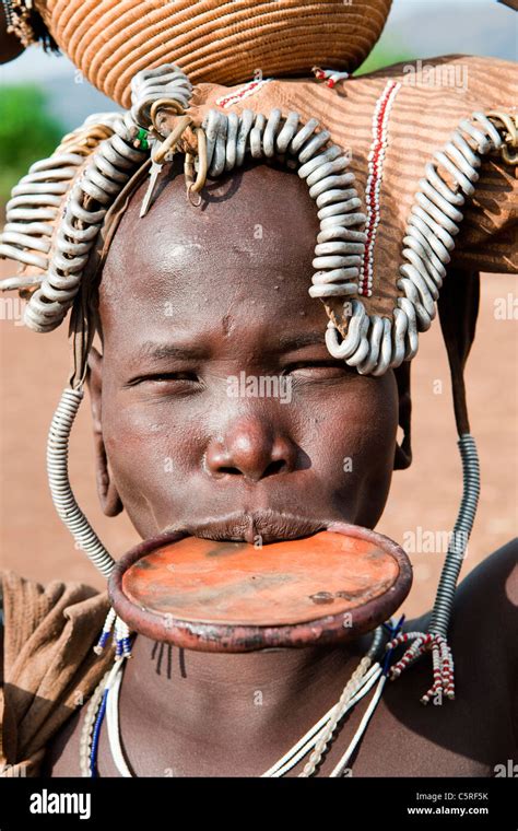 Portrait Of A Mursi Tribeswoman Wearing A Traditional Lip Plate At A
