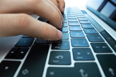 Hands Using The Keyboard And Touchpad Of A Laptop Computer On A White