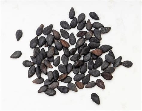 Premium Photo Several Black Sesame Seeds Close Up On Gray