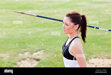 Concentrated Female Athlete Ready To Throw Javelin Stock Photo Alamy