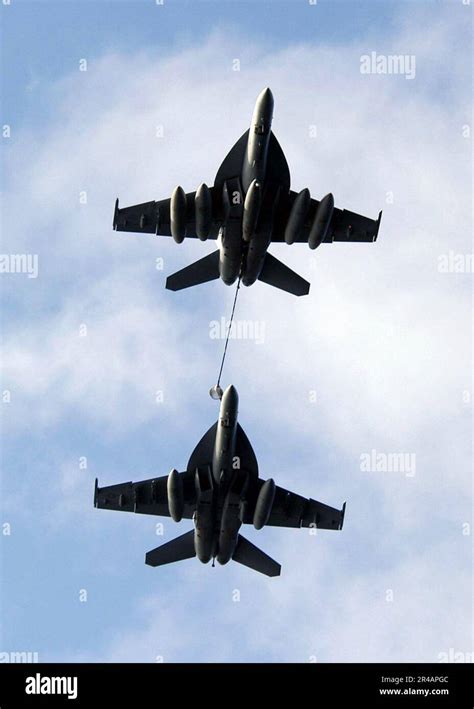 Us Navy Two F A 18f Super Hornets Perform Aerial Refueling During A