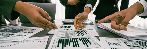 Analyst Team Analyzing Business Data Paper On Office Table Prodigy