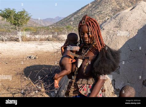 Himba Tribeswomen At Epupa Falls Cunene River In Namibia On The Border