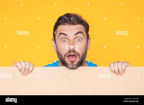 Surprised Funny Man Holds The White Sign Blank Card Placard Ready For