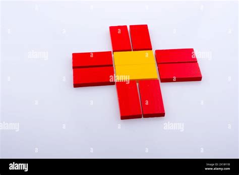 Colorful Domino Blocks Forming A Sun Shape On A White Background Stock