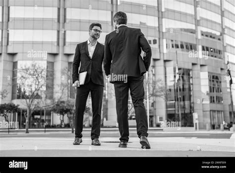 Two Business Men Handshaking Full Length Two Business Men Handshaking