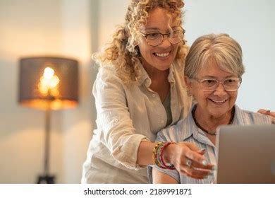 Beautiful Mature Blonde Woman Teaching Her Stock Photo
