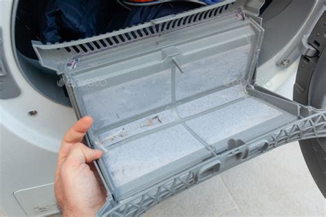 Clean Dryer Lint Filter In Hand Stock Photo By AntonioGravante PhotoDune