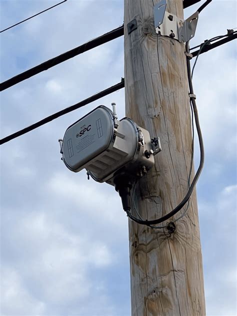 What Is This White Oval Box Labeled With Spc Mounted High Up On A