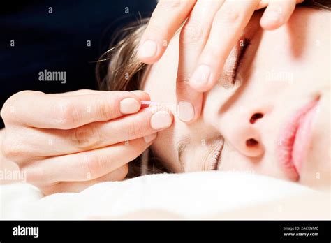 Acupuncture Treatment Close Up Of The Face Of A Woman Having An
