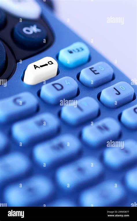Macro Image Of A Modern Keyboard Highlighting Blue Buttons And A White Upper And Lower Case