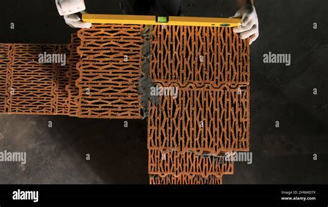 Close Up Of Builder Using Leveler For Brickwork Stock Footage