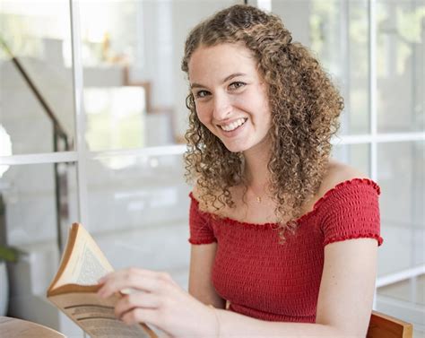 Premium Photo Beautiful Girl Smiling Woman Reading A Book At Home