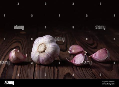 Garlic Cloves And Bulb On Wooden Table Fresh Peeled Garlics And Bulbs