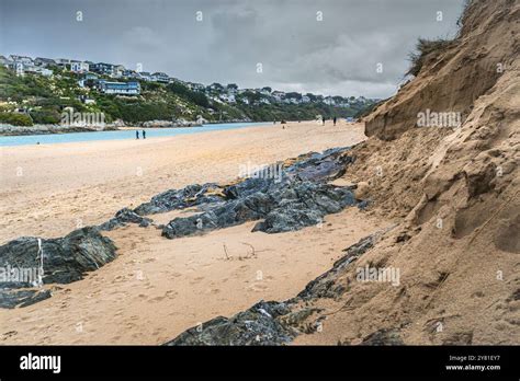 Rocks Exposed By Erosion Of The Sand Dune System At Crantock Beach In Newquay In Cornwall In The