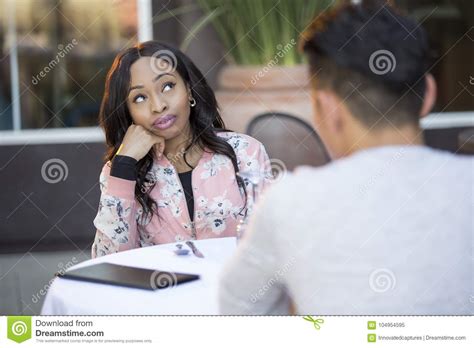 Interracial Blind Date In Outdoor Restaurant Stock Image Image Of