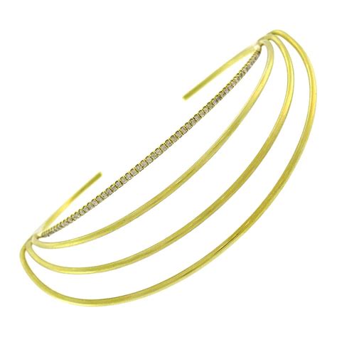 Cartier 1980s Ruby Pave Diamond 18 Karat Yellow Gold Bangle Bracelet At