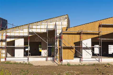 Scaffolding Around House For Installing Wood Siding Overhang Stock