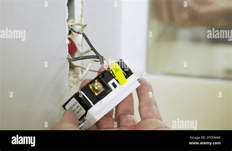 Electrician Installing Wires On The New Ground Fault Outlet K Stock Video Footage Alamy