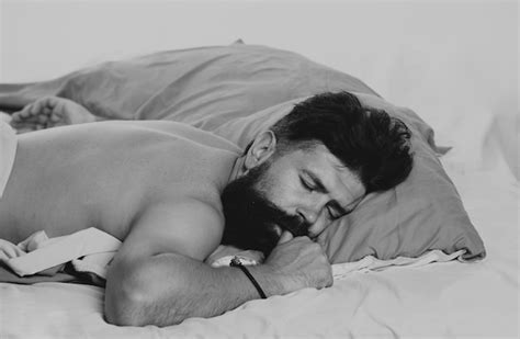 Premium Photo Happy To Sleep Man Lying In Bed And Sleeping Guy Lying