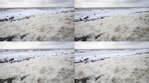 在英国坎布里亚郡的怀特黑文附近，一场强风暴掀起的泡沫。视频素材下载编号33992710光厂vj师网