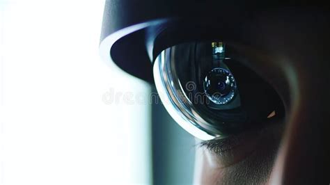 A Cinematic Frame Of A Person Noticing A Hidden Camera Watching Them Evoking Feelings Of Unease