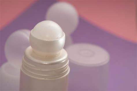 Premium Photo A White Lip Balm With A White Cap Sits On A Purple