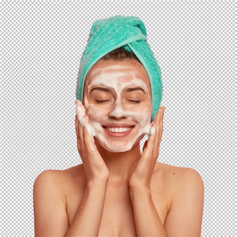 Premium PSD Pleased Smiling Woman Washes Face With Cleansing Gel Has