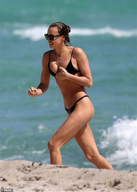 Irina Shayk Showcases Her Long Legs And Her Flat Midriff In Tiny Black