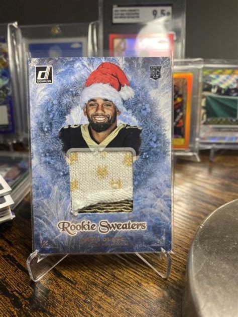 2022 Panini Donruss Rookie Holiday Sweater RHS 9 Chris Olave MEM