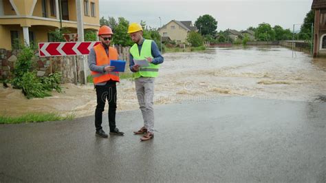 Male Engineers Solve Flood Problem Devastation Wrought After Massive Disasters Stock Video