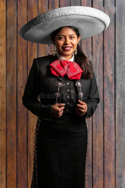 Female Mexican Mariachi Woman Smiling Using A Traditional Mariachi Girl