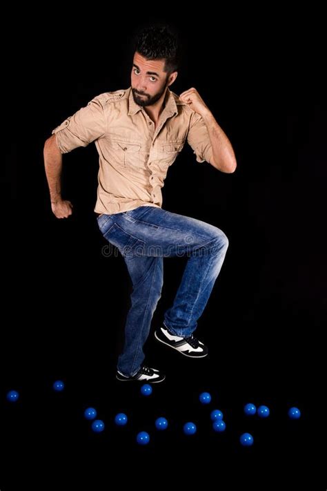 Handsome Playful Guy In Pink Glasses On A Blue Background Dancing And