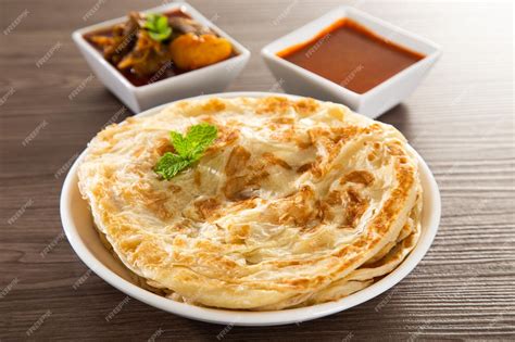 Premium Photo Roti Parata Or Roti Canai With Lamb Curry Sauce