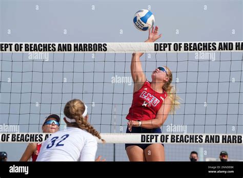 Madi Firnett Of Loyola Marymount Spikes The Ball Against Pepperdine