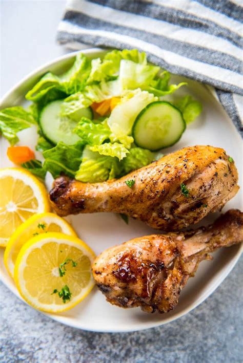 Lemon Herb Grilled Chicken Drumsticks Garnished Plate