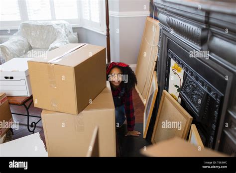 Portrait Cute Playful Girl Among Cardboard Boxes Moving House Stock Photo Alamy
