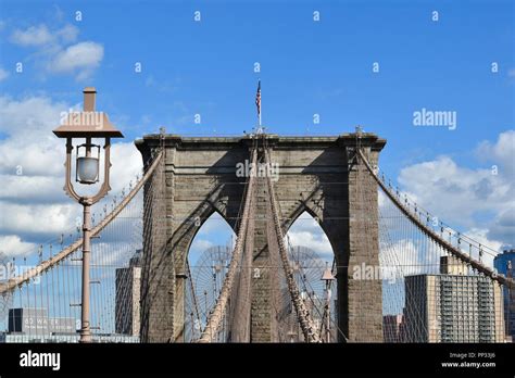 The Iconic Brooklyn Bridge Spanning The East River Between Lower