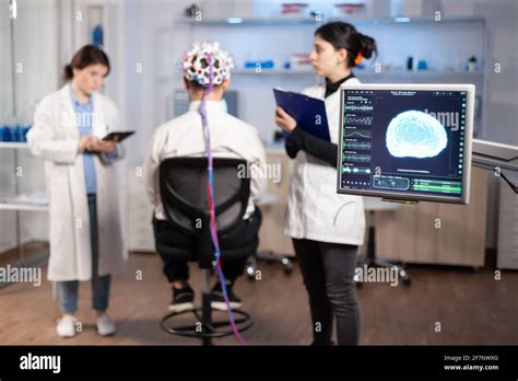 Man Patient Wearing Performant Eeg Headset Scanning Brain Electrical Activity In Neurological