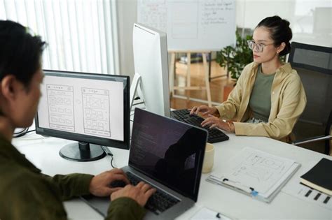 Premium Photo Front End Developers Working On Website For New Project