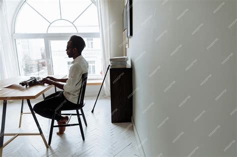 Premium Photo Man In White Dress Shirt Sitting On Chair Photo