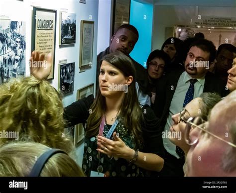 Paris France French Tourist Guide Talking To Group Tourists Inside Police Museum Exhibit