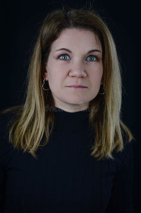 Portrait Of A Beautiful Blond Woman With Her Eyes Wide Open And A