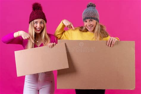 Females With Hats And Colorful Blouses Holding Empty Cardboard For