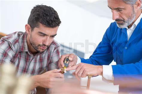 Men Fixing Something Stock Image Colourbox