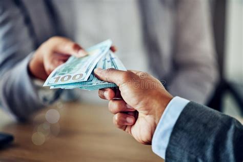 Hands Of A Businessman Paying Money For A Service Contract Or